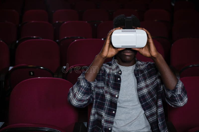 Man Using Virtual Reality Headset while Watching Movie Stock Image ... Man Using Virtual Reality Headset while Watching Movie Stock Image ...