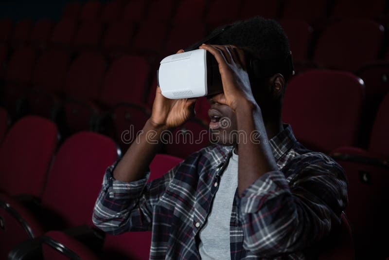 Man Using Virtual Reality Headset while Watching Movie Stock Photo ...