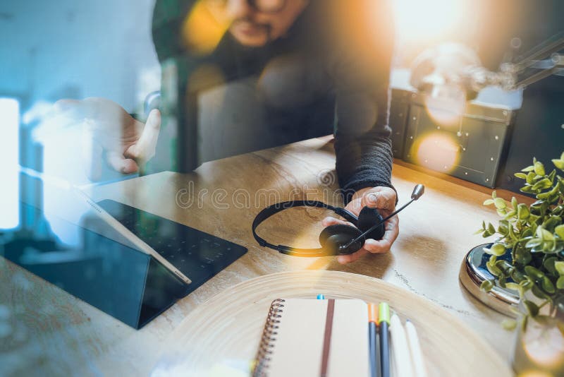 Man Using VOIP Headset with Digital Tablet Computer Docking Smart ...