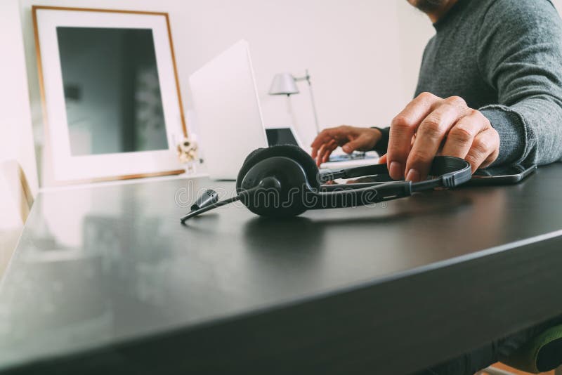 Man Using VOIP Headset with Latop Computer on Desk in Modern Off Stock ...