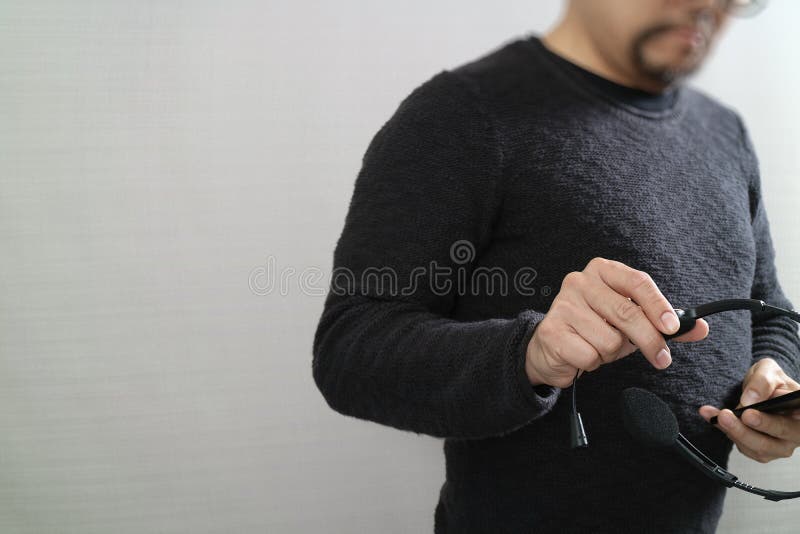 Man Using VOIP Headset with Smart Phone, Concept Communication, Stock ...