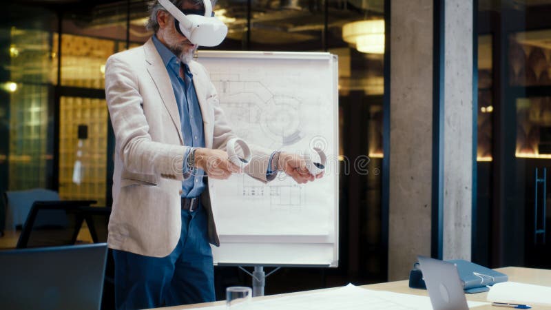 Man Using VR Controllers in Office Stock Photo - Image of company ...