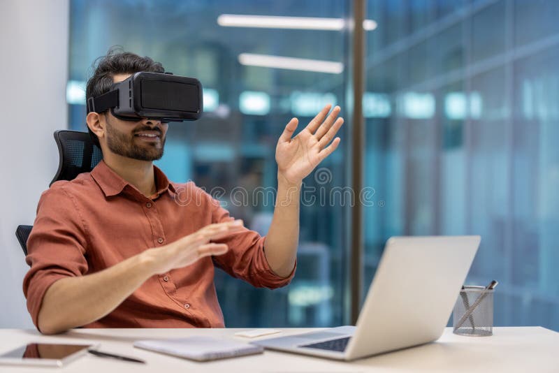 Businessman Exploring Virtual Reality with VR Headset in Modern Office ...