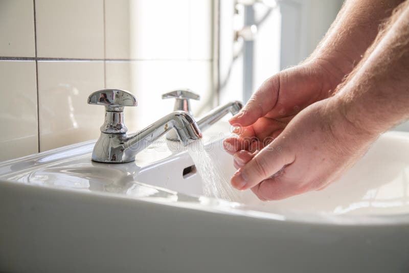 Man Using Washbasin with Tap Water for Washing Hands Stock Image ...