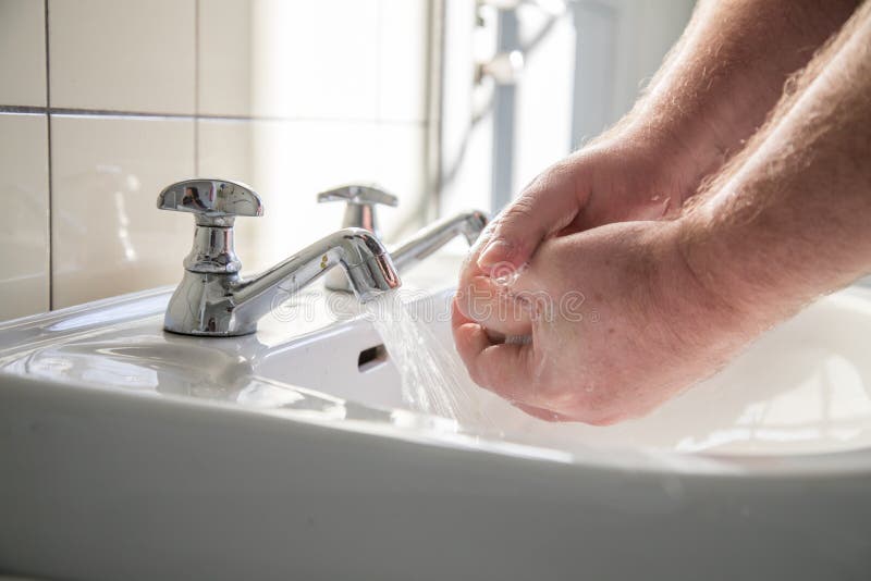 Man Using Washbasin with Tap Water for Washing Hands Stock Image ...