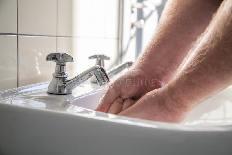 Man Using Washbasin with Tap Water for Washing Hands Stock Image ...