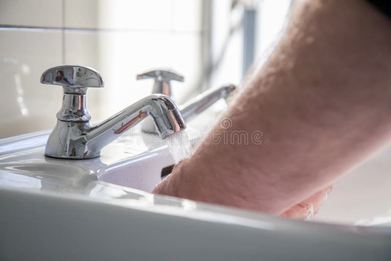 Man Using Washbasin with Tap Water for Washing Hands Stock Image ...
