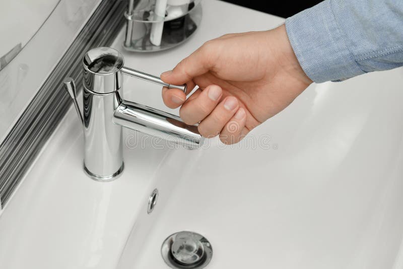 Man Using Water Tap in Bathroom, Closeup Stock Image - Image of metal ...