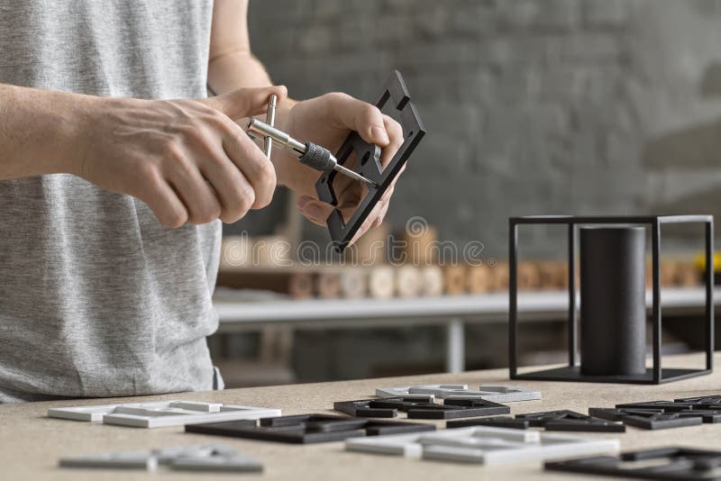 Man Using Wrench in Workshop Stock Photo - Image of male, cylindrical ...