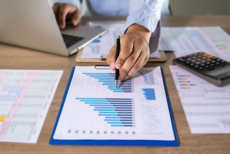 Man Usingcalculator with Money Stack Financial Report- Business ...