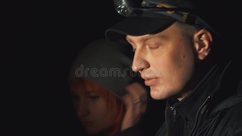 A Man Utters Words while Looking at the Camera at Night Outside Stock ...