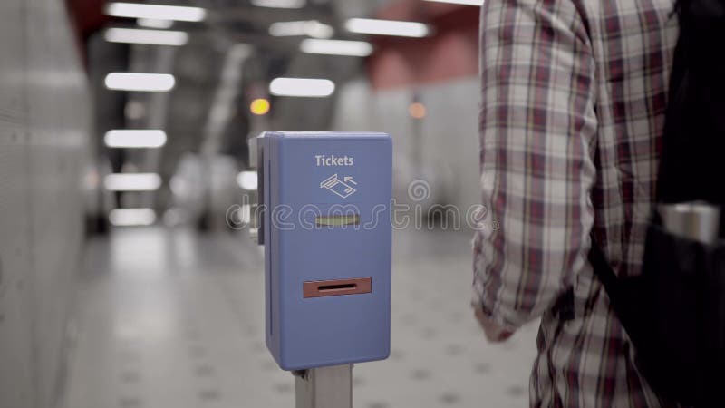 A Man Validating a Ticket in a Machine for Validation of a Transport ...