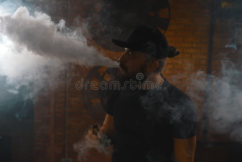 Man Vaping an Electronic Cigarette Stock Photo - Image of cool, casual ...