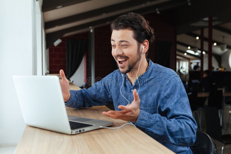 Man Video Chatting on Laptop Computer in Office Stock Image - Image of ...