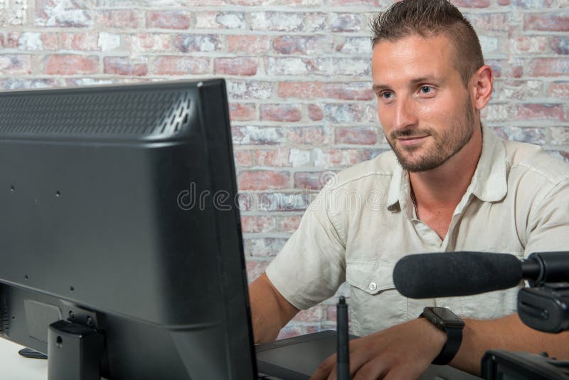 Man Video Editor with Computer and Professional Video Camera Stock ...