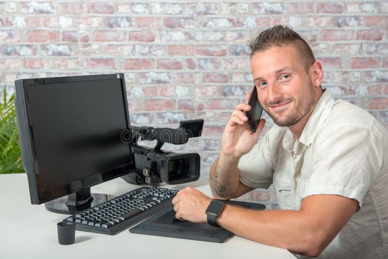 Man Video Editor Using Graphic Tablet and Phone Stock Image - Image of ...