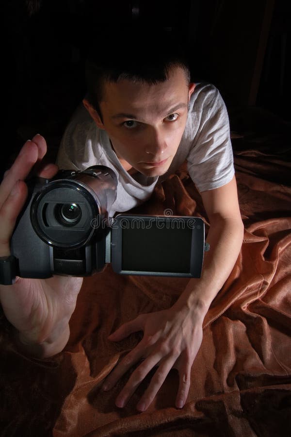Man with videocamera stock image. Image of controlled - 165715867
