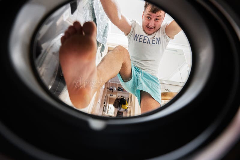 Man View from Washing Machine Inside. Male Does daily Routine Stock ...