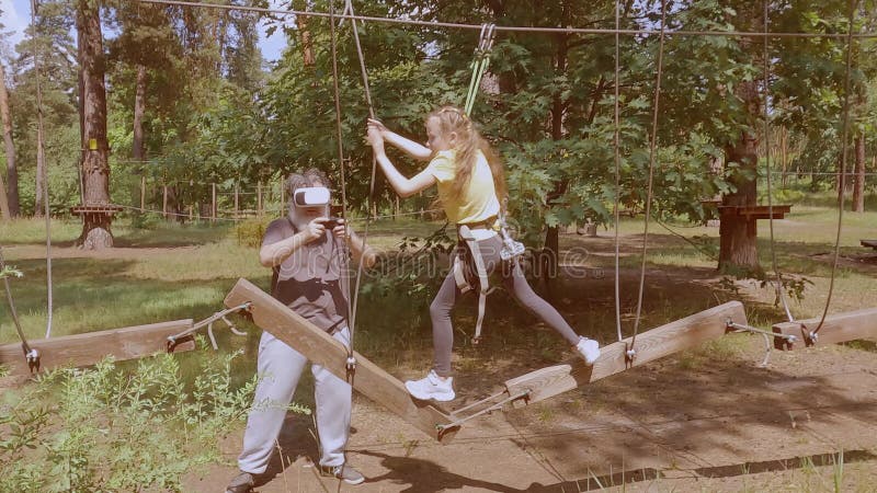 A Man Plays a Computer Game while Controlling a Child. Stock Video ...