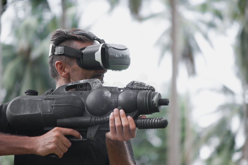 Man in Virtual Reality Headset Playing Video Game Outdoors Stock Photo ...