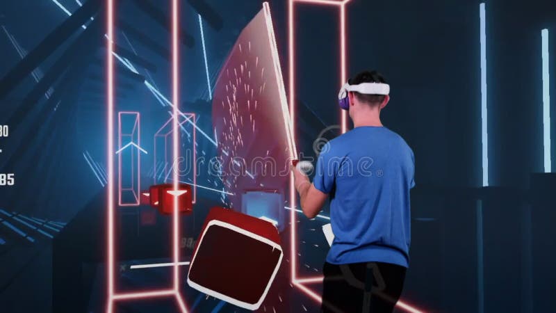 Man in a Virtual Reality Headset Plays an Action Video Game in ...