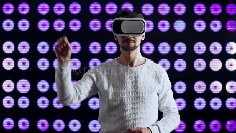 Man in a Virtual Reality Helmet Draws with His Hand in the Computer ...