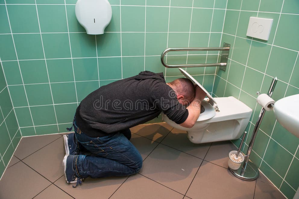 Man vomiting in the toilet stock image. Image of table - 55258645