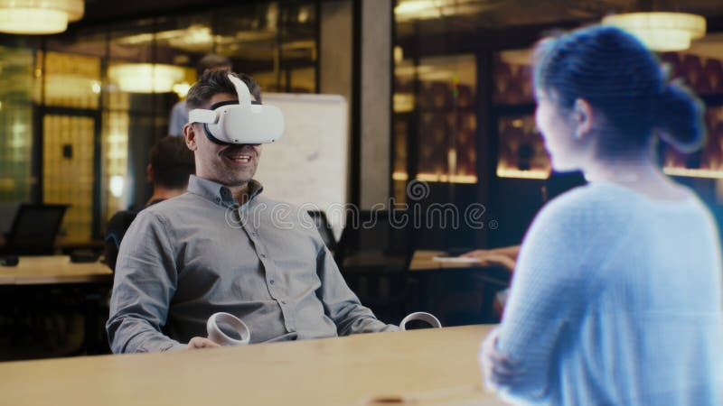 Man with VR Headset Takes Interview of a Candidate Using Augmented ...