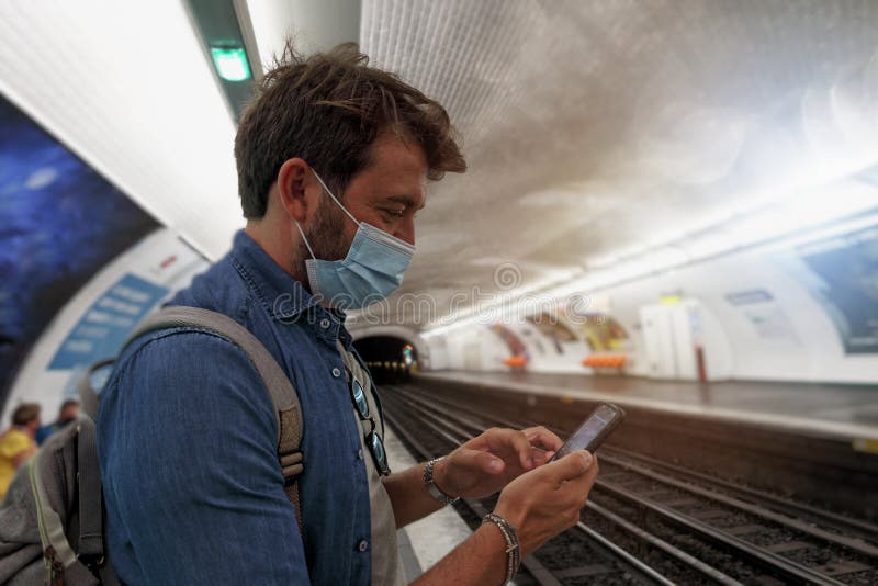 Man Wait for the Subway and Plan His Trip with Smartphone Stock Image ...