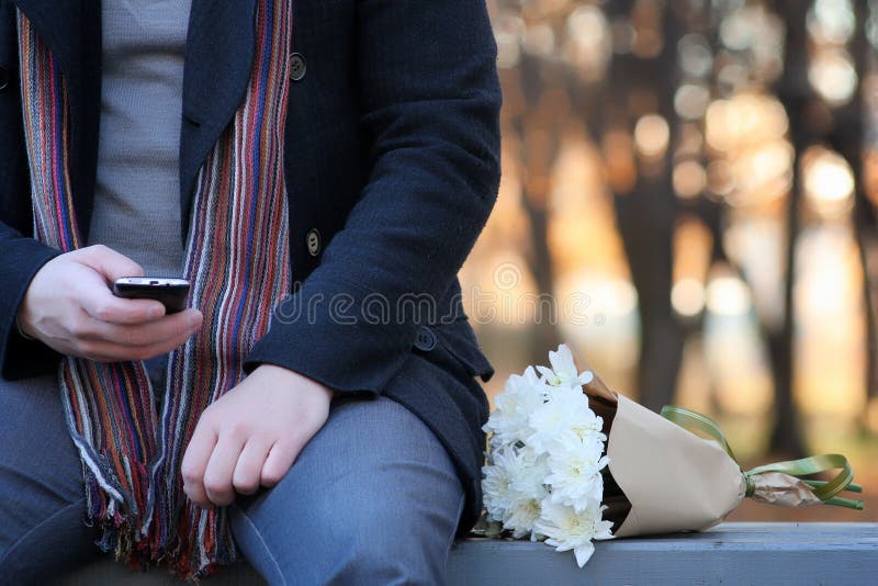 Man Waiting on a Bench the Date in Autumn Park Stock Photo - Image of ...