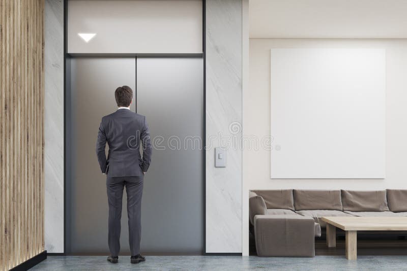 Man Waiting for Elevator in Company Lobby Stock Photo - Image of ...