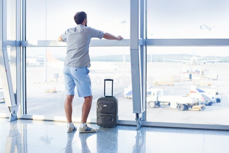 Man Waiting for His Flight in the International Airport Stock Photo ...