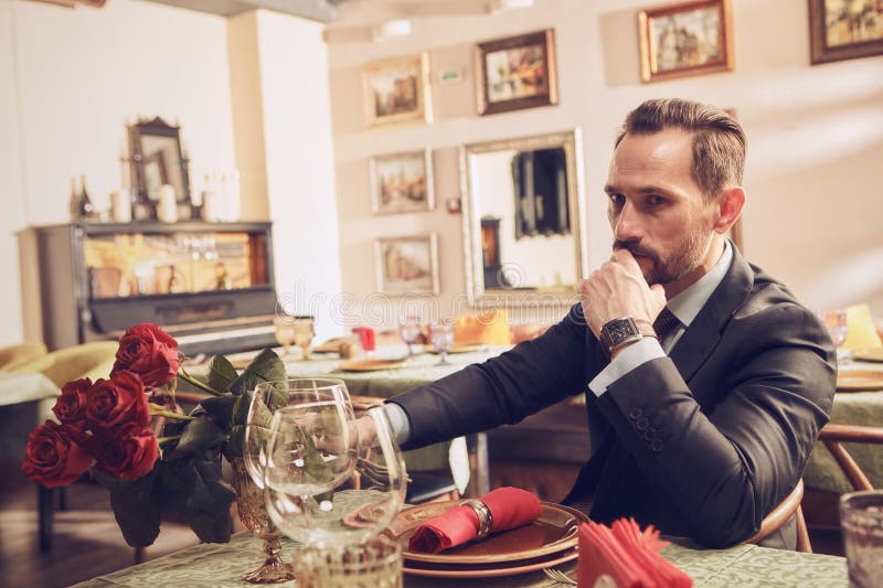 A Man is Waiting in a Restaurant. Stock Photo - Image of beautiful ...