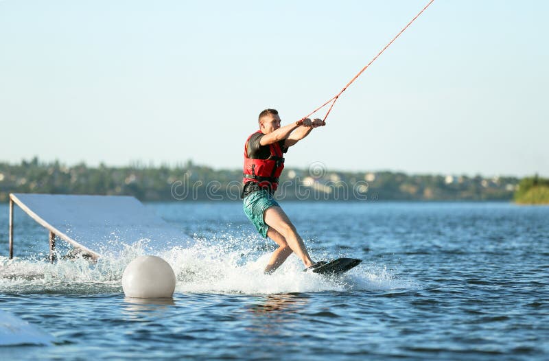 Man Wakeboarding on River. Extreme Water Sport Stock Photo - Image of ...