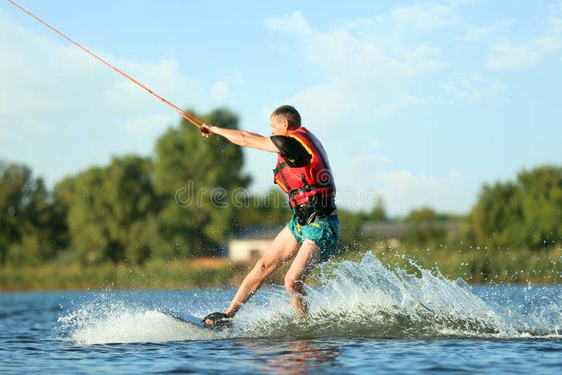 Man Wakeboarding on River. Extreme Water Sport Stock Photo - Image of ...