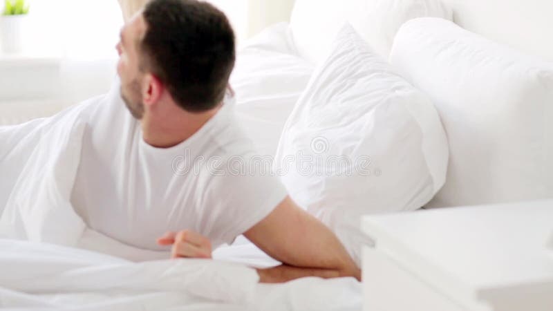 Man Waking Up in Bed at Home Stock Footage - Video of lying, rest: 95006002