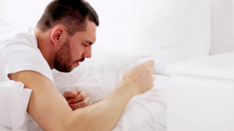 Man Waking Up and Drinking Water in Bed at Home Stock Footage - Video ...