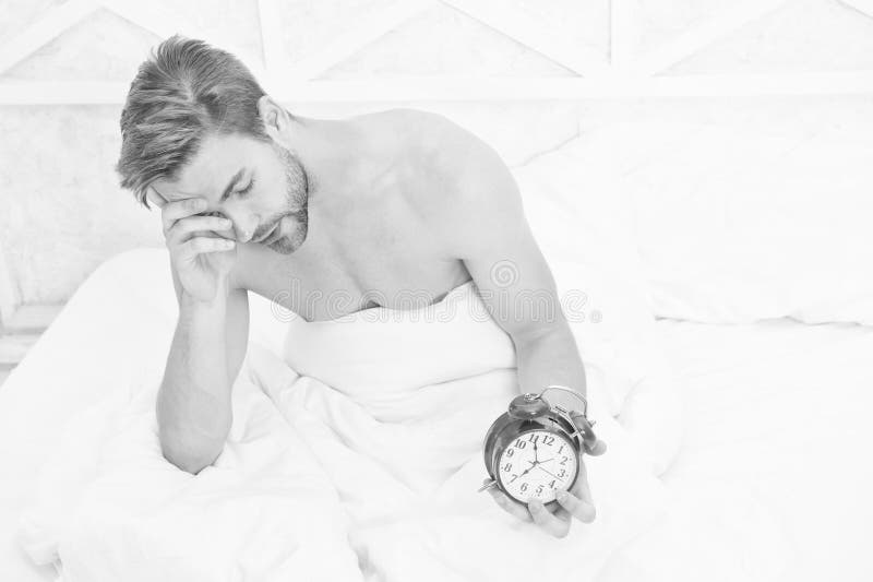 Man Waking Up Early Morning Ringing Alarm Clock, Exhausted Concept ... Man Waking Up Early Morning Ringing Alarm Clock, Exhausted Concept ...