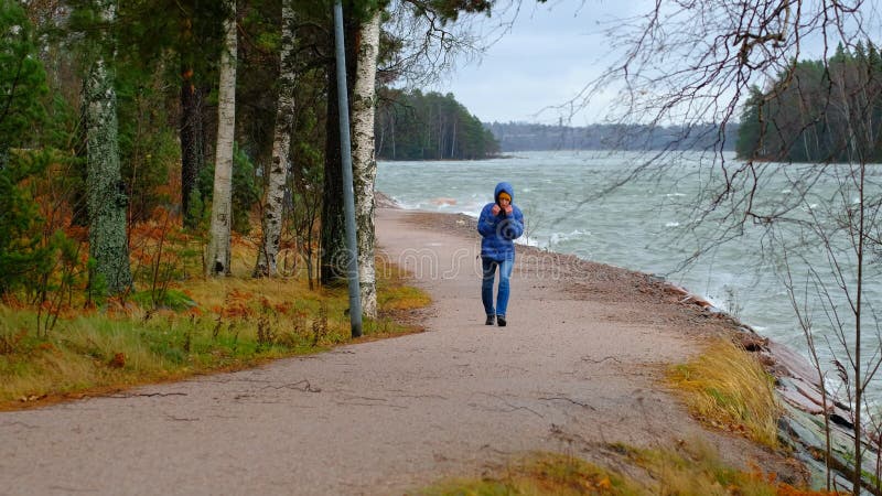 A Man is Walking Against a Strong Stormwind Stock Video - Video of male ...