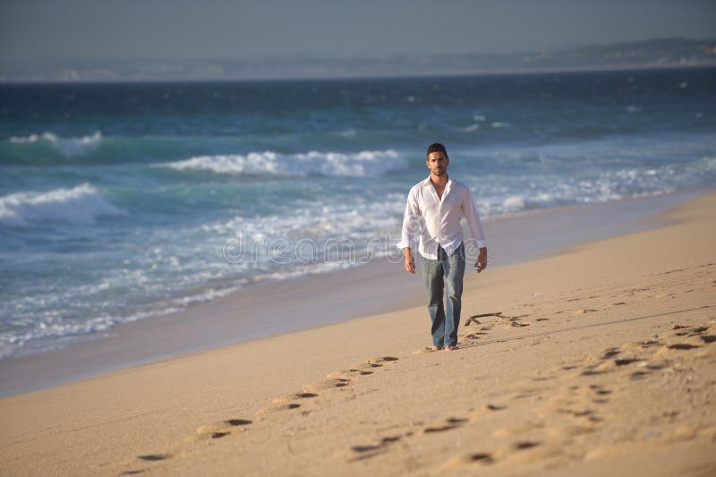 Man Walking Alone at the Beach Stock Photo - Image of alone, landscape ...