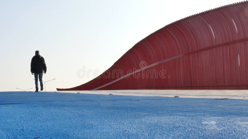 Man Walking Alone on Empty Street or Bridge. Back View Stock Image ...