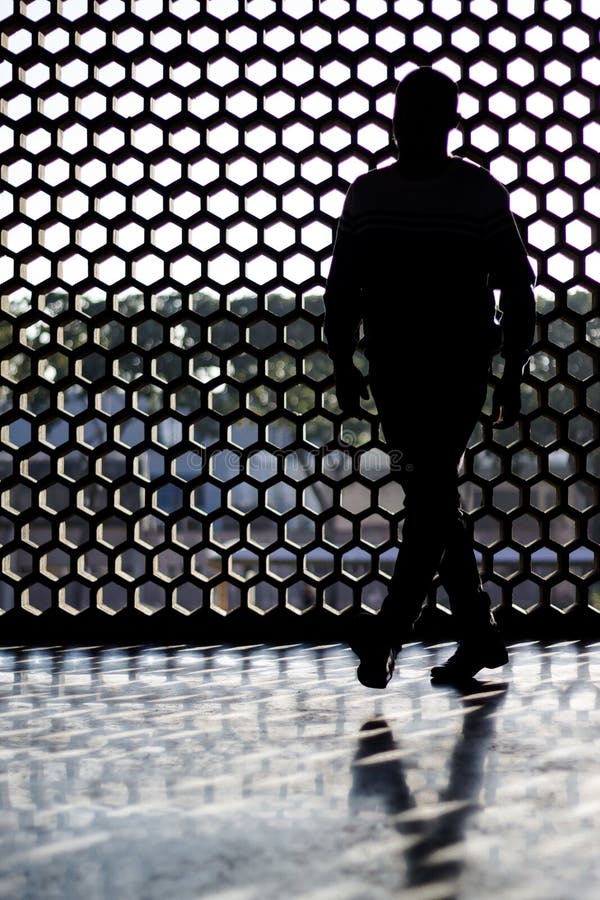 Man Walking Backwards Against Backlighting Stock Photo - Image of ...