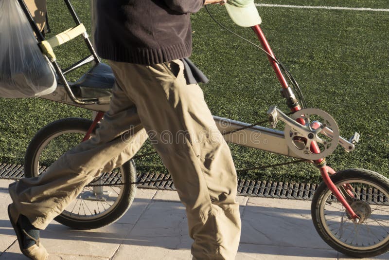 Man Walking with Bike in Hand Stock Photo - Image of walking, people ...