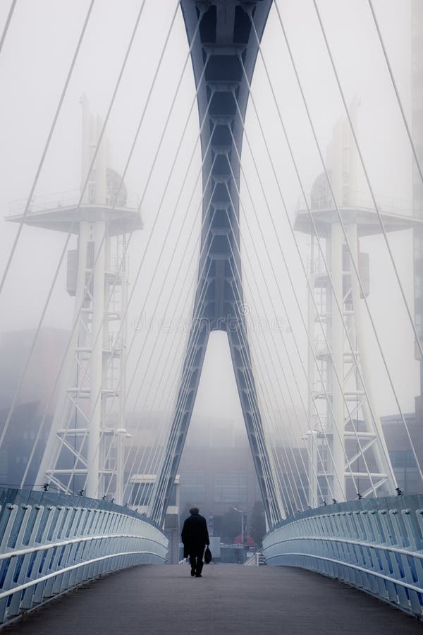 Man walking on bridge editorial stock image. Image of light - 46975684