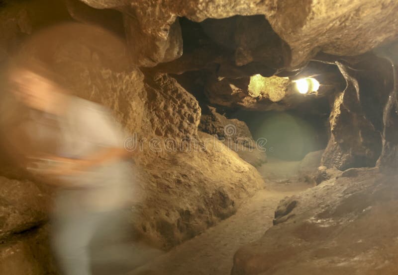 Man walking in a cave stock photo. Image of earth, nature - 246641062