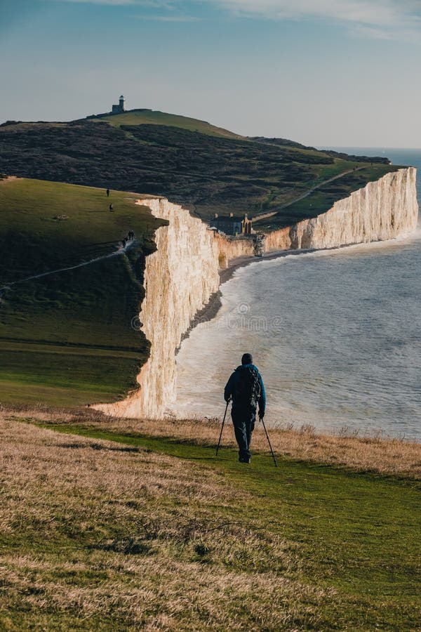 Man walking on the cliffs stock photo. Image of seven - 183501630