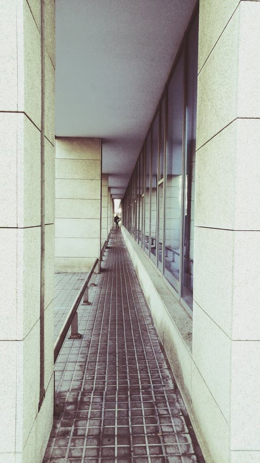 Man Walking in a Corridor. Street Architecture Stock Photo - Image of ...