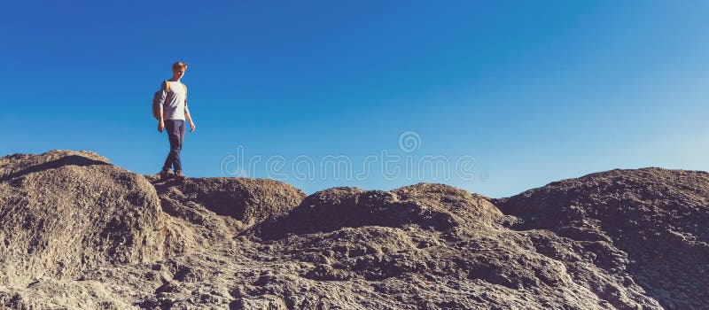Man Walking on the Edge of a Cliff Stock Photo - Image of alone, hiker ...