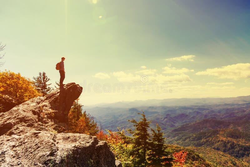 Man Walking on the Edge of a Cliff Stock Photo - Image of filtered ...