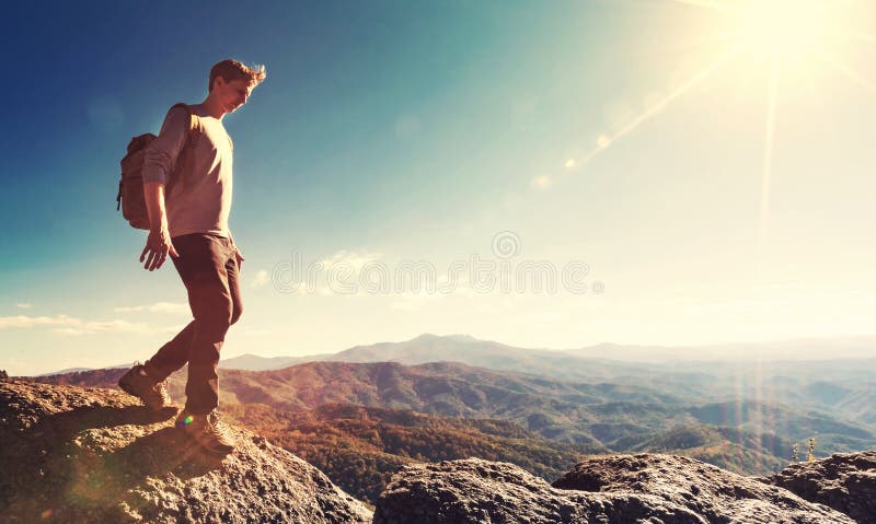 Man Walking on the Edge of a Cliff Stock Image - Image of filtered ...